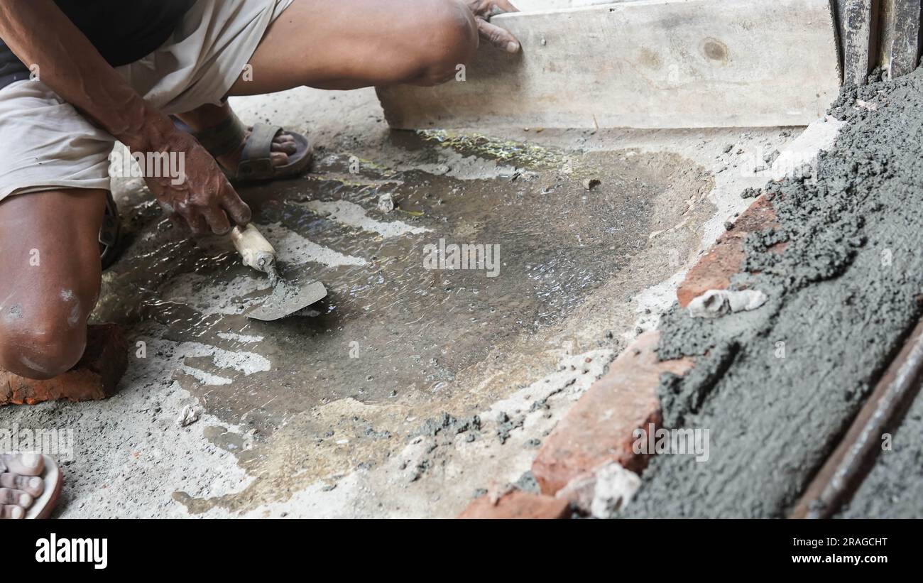 Worker or mason hands laying bricks close up. Bricklayer works at brick ...