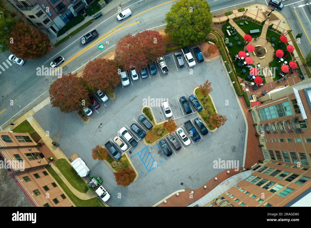 Aerial view of many colorful cars parked on parking lot on apartment ...