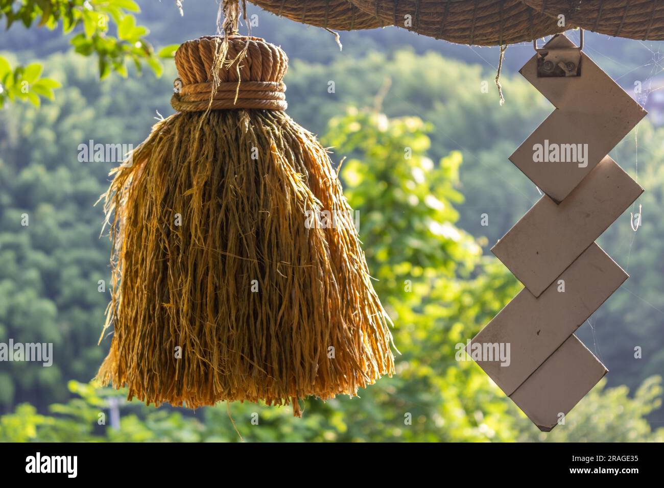 Sacred rope, or shimenawa, and zigzag streamers, or shide ...