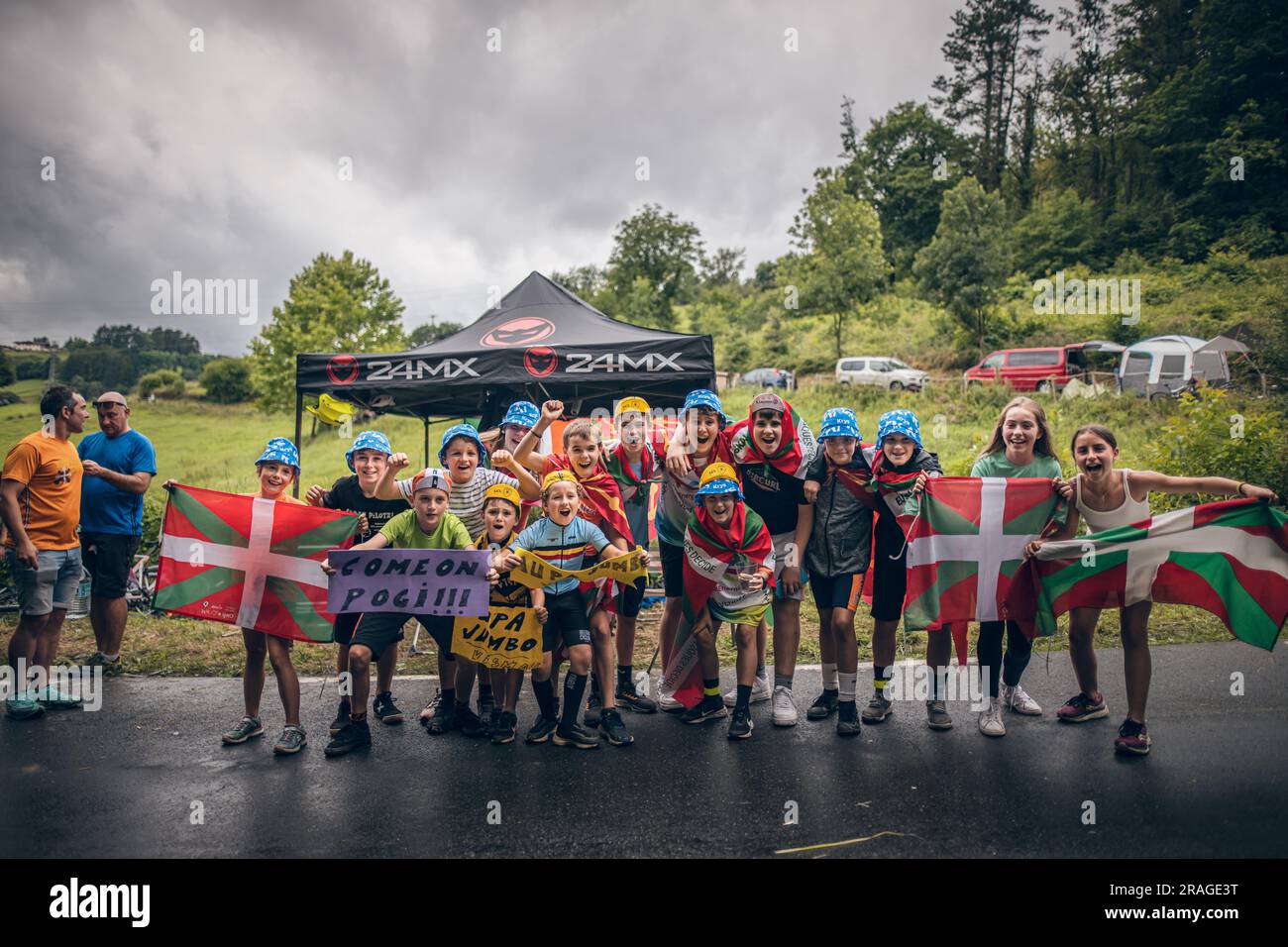 Group of Basque fan children with the flags in a stage of the Tour de ...