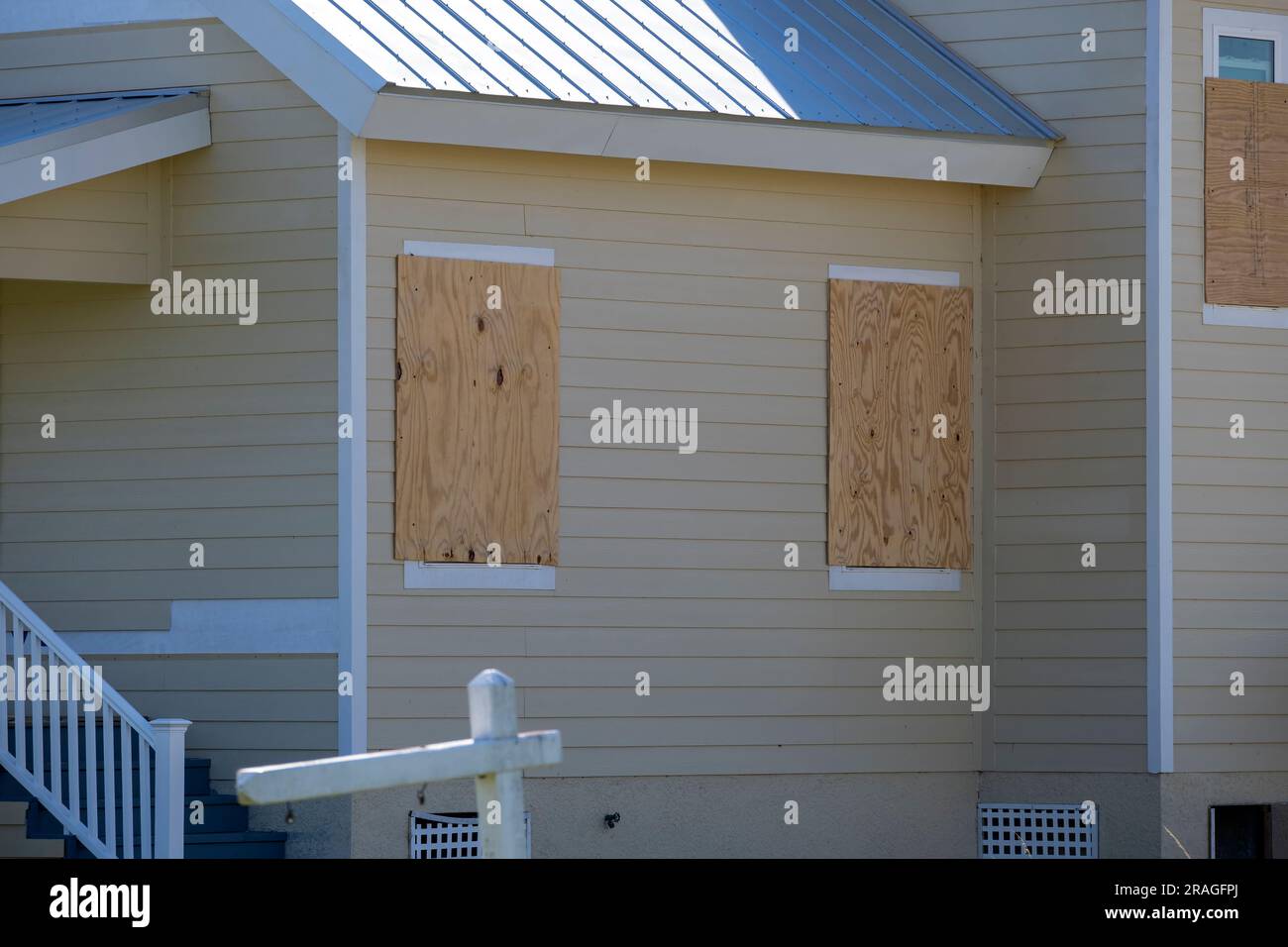 Plywood storm shutters for hurricane protection of house windows ...
