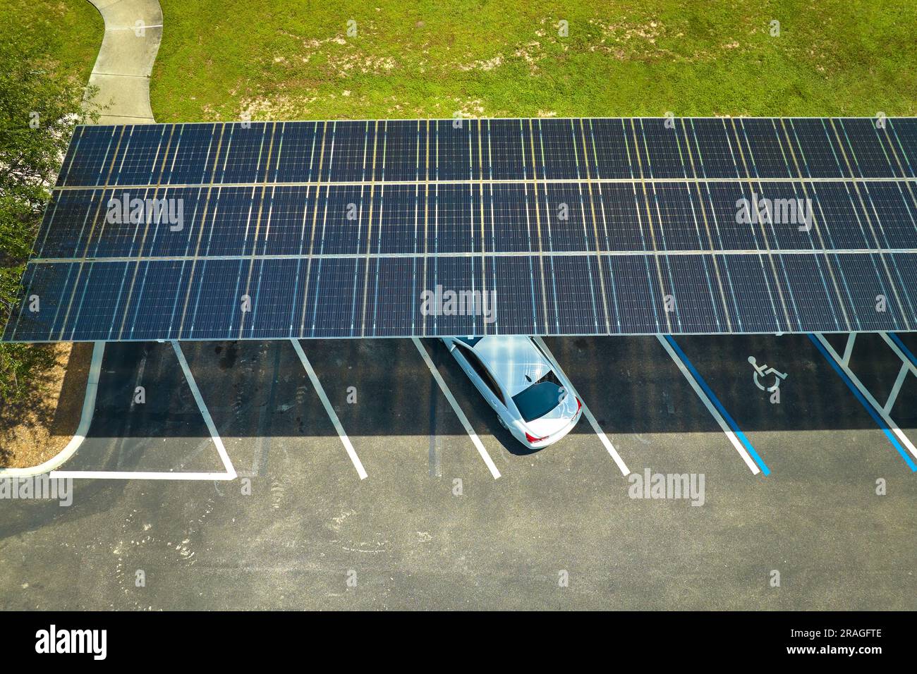 Solar panels installed over parking lot for parked cars for effective ...