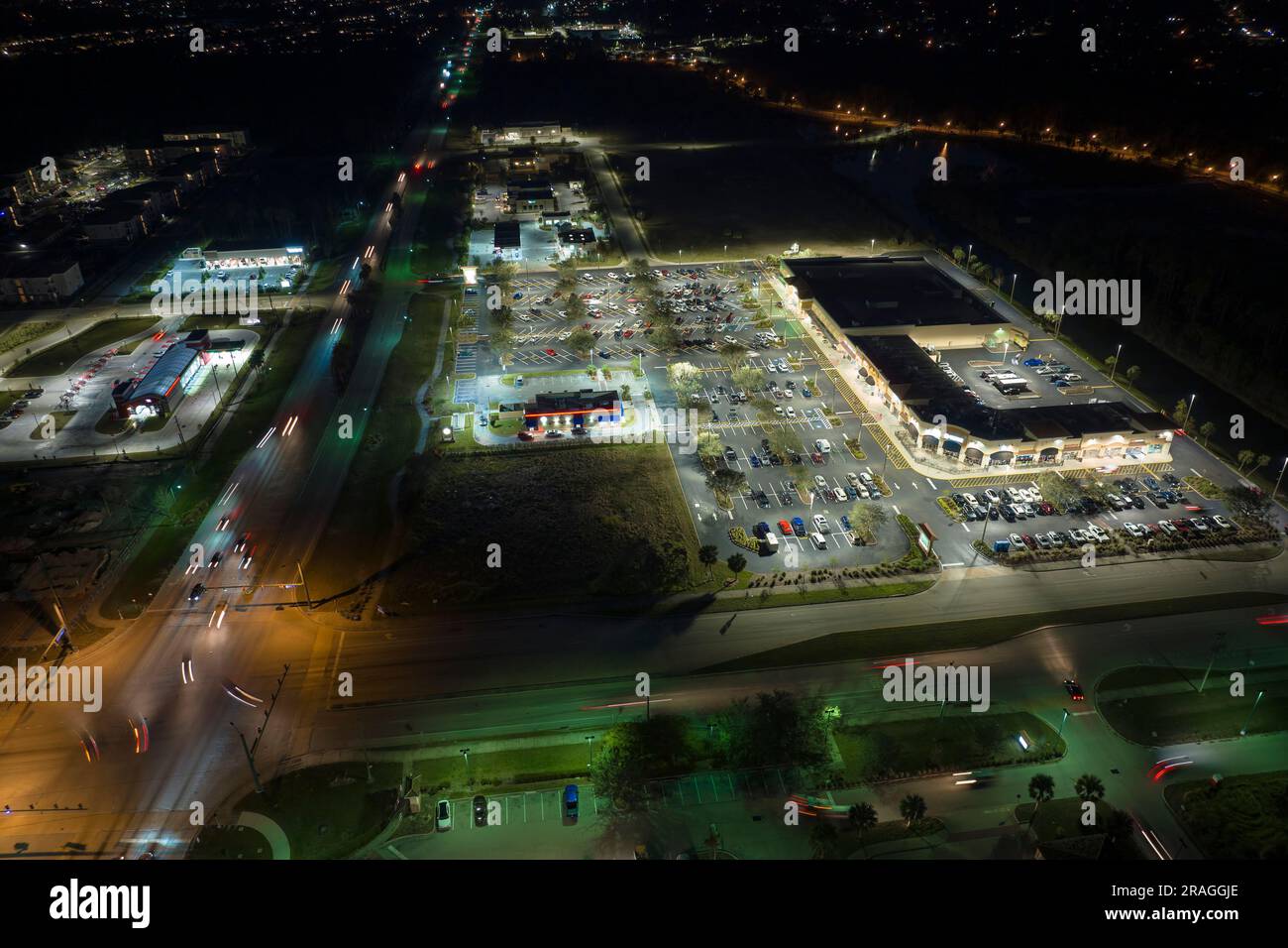 View from above of many parked cars on illuminaded parking lot with ...