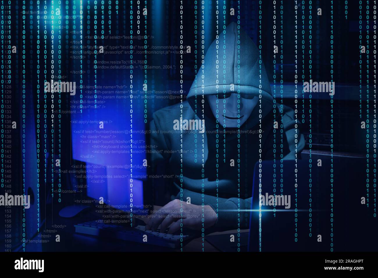Anonymous man in mask with computers, source and binary code in darkness Stock Photo - Alamy