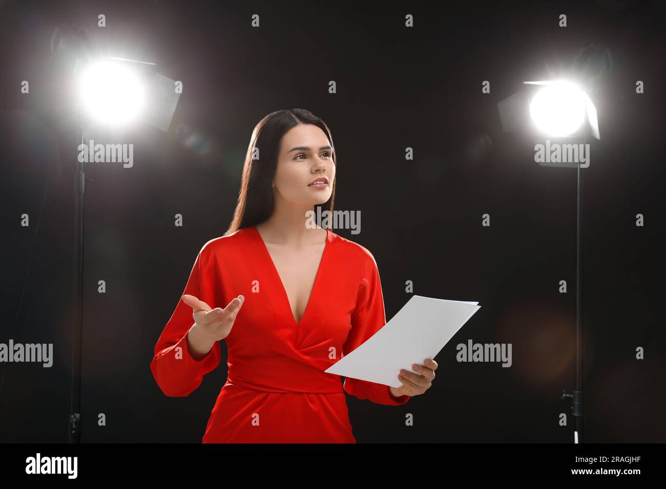 Actress with script performing on stage. Film industry Stock Photo - Alamy