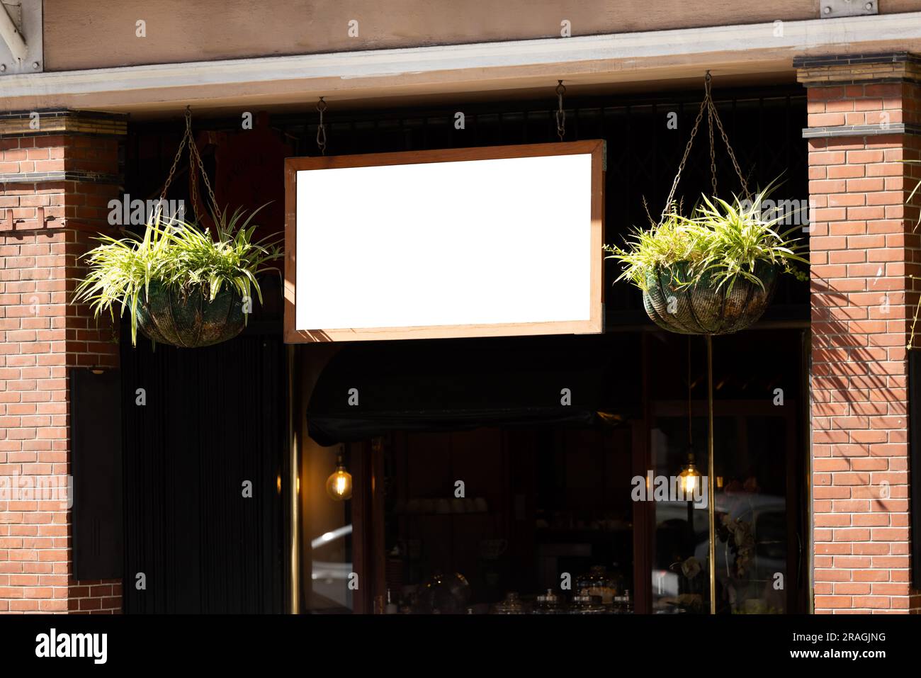 Blank sign hanging from building ceiling with copy space Stock Photo ...