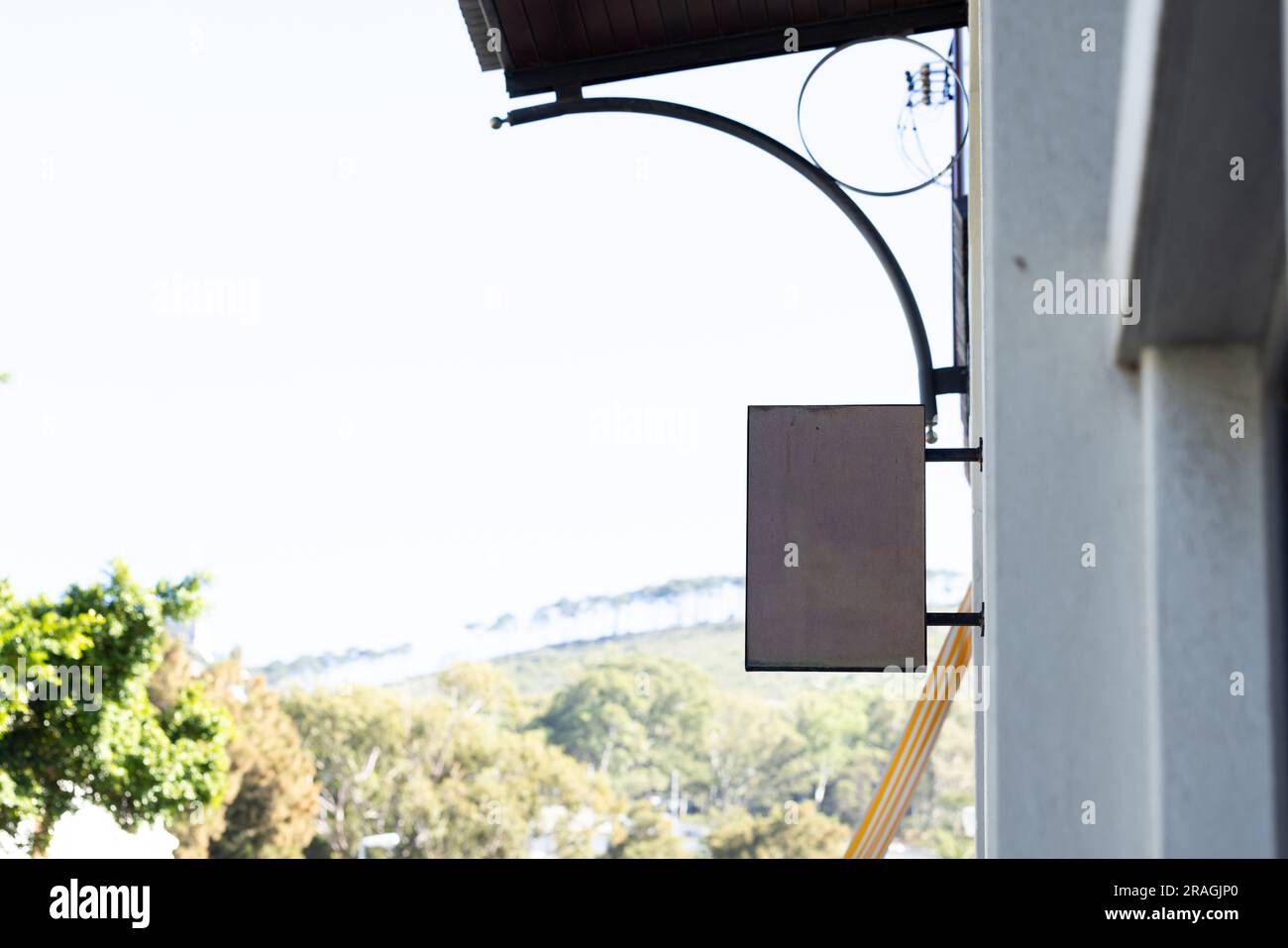 Blank sign fixed to building wall with copy space Stock Photo - Alamy