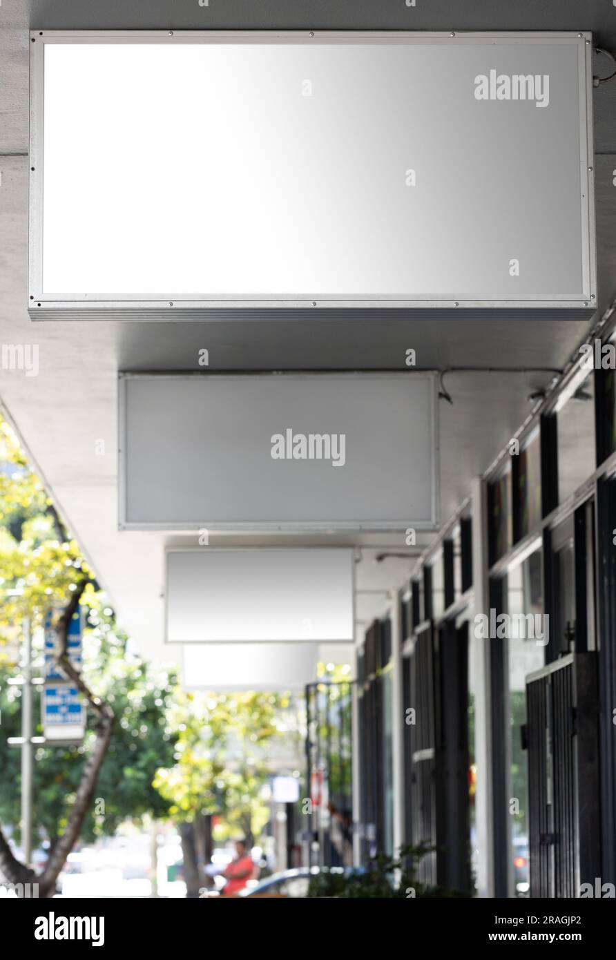Blank signs hanging from building ceiling with copy space Stock Photo ...