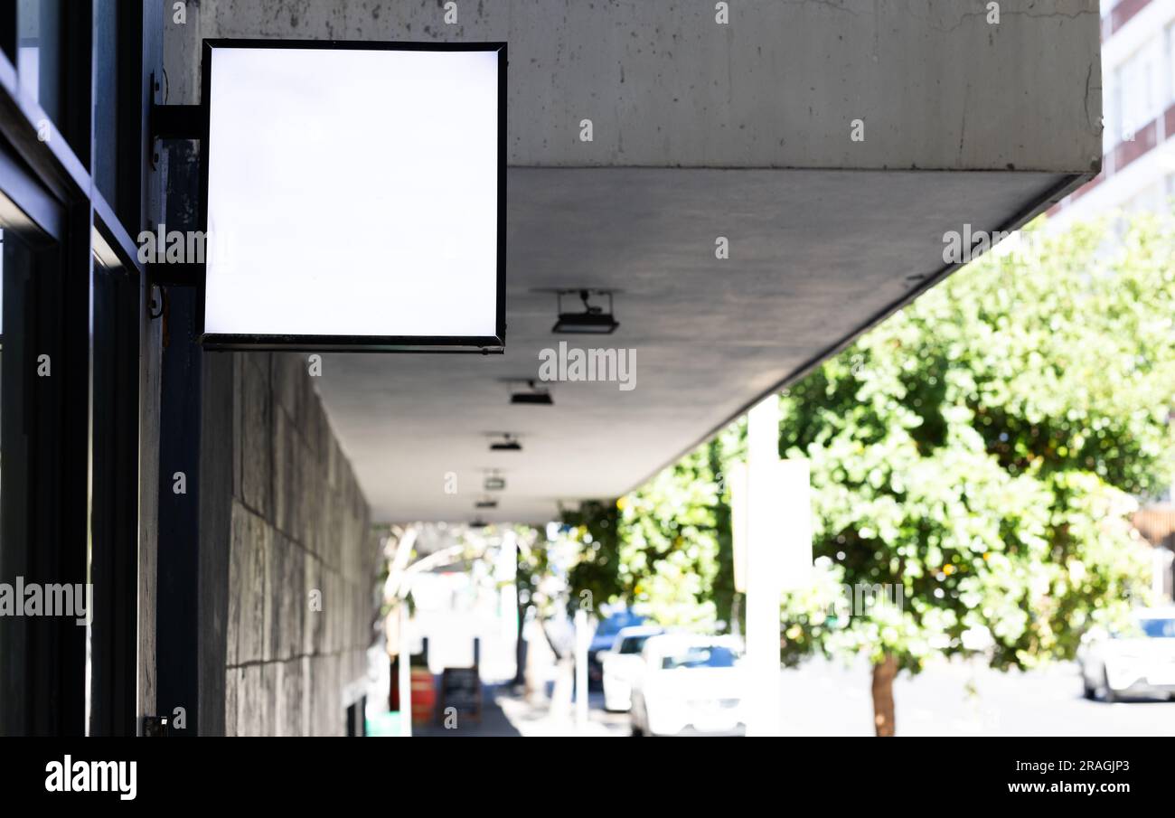 Blank sign fixed to building wall with copy space Stock Photo - Alamy