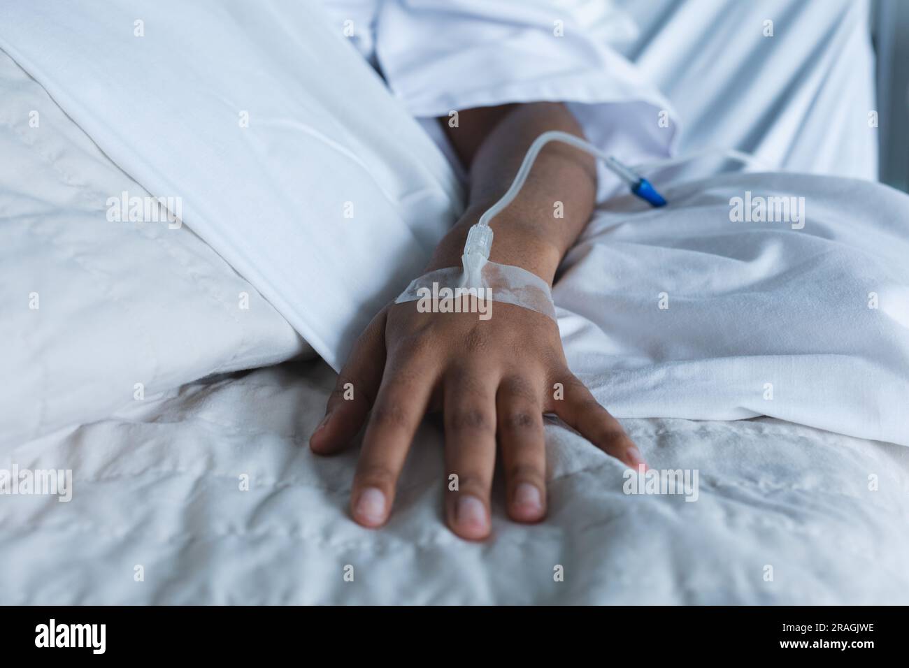 Close up of hand of african american female patient with drip on hand ...
