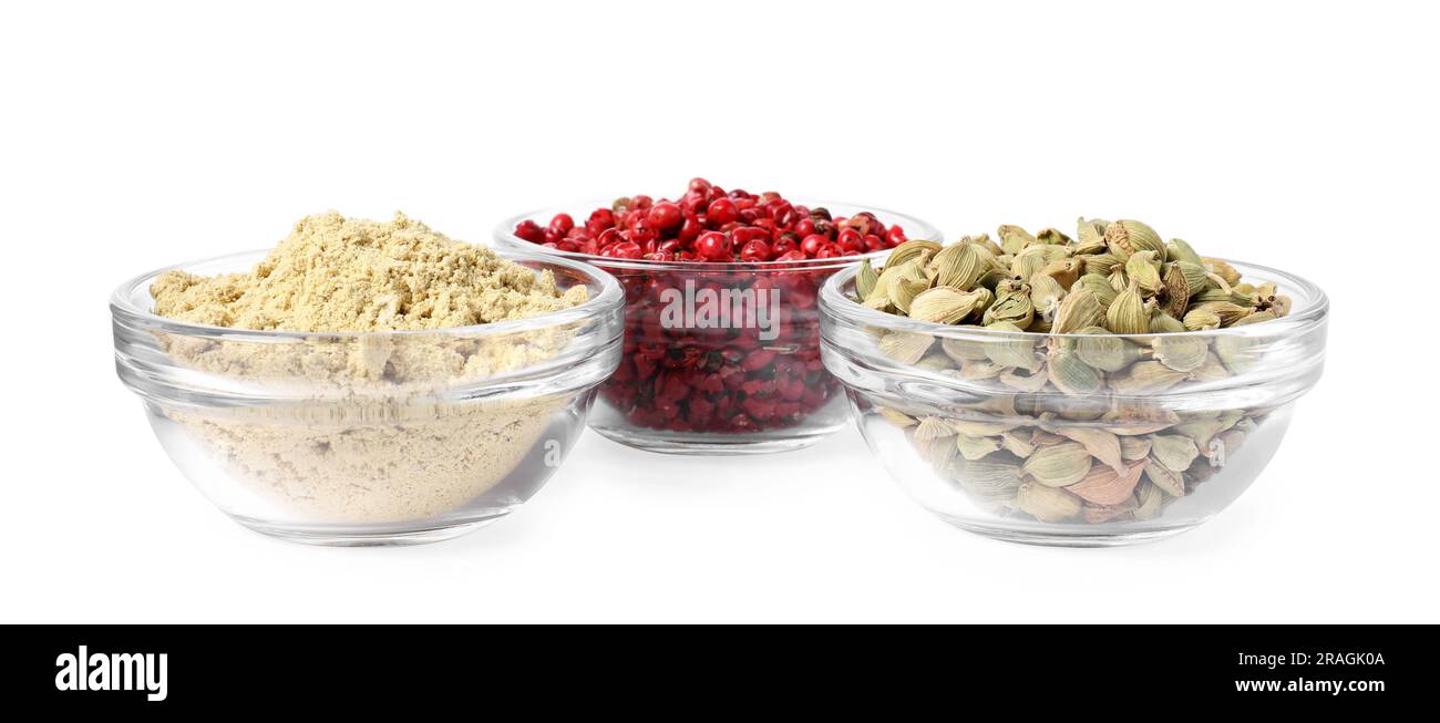 Bowls with dried cardamom, ginger root powder and red peppercorns on ...