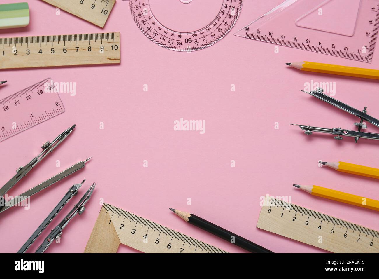 Flat lay composition with different rulers and stationery on pink ...