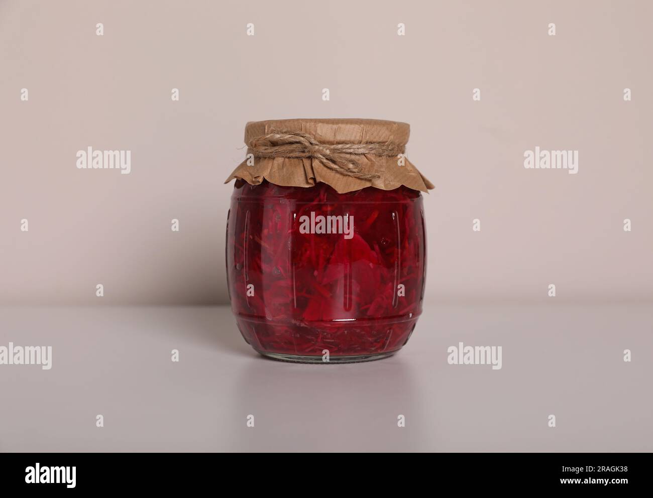Jar of tasty pickled beets on white background Stock Photo - Alamy