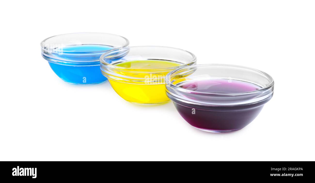 Glass bowls with different food coloring on white background Stock ...