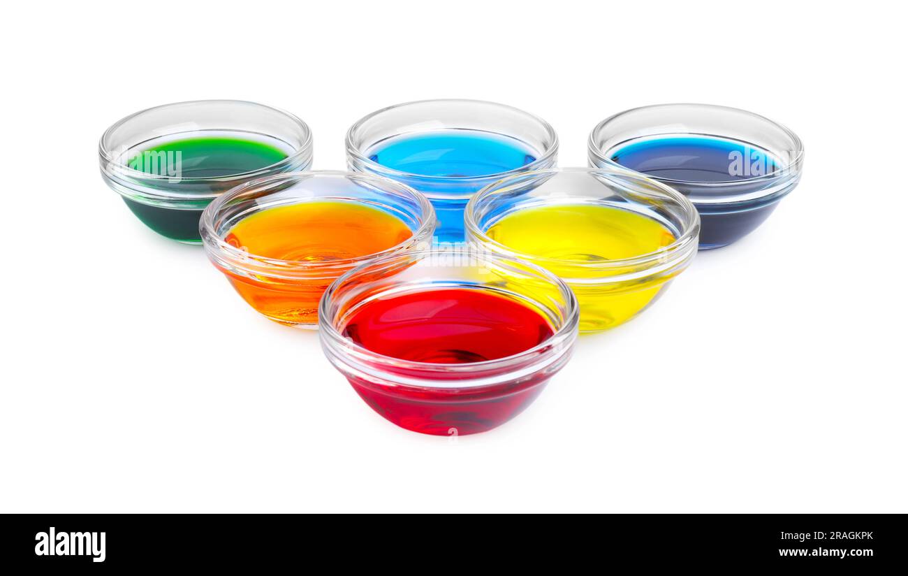 Glass bowls with different food coloring on white background Stock ...
