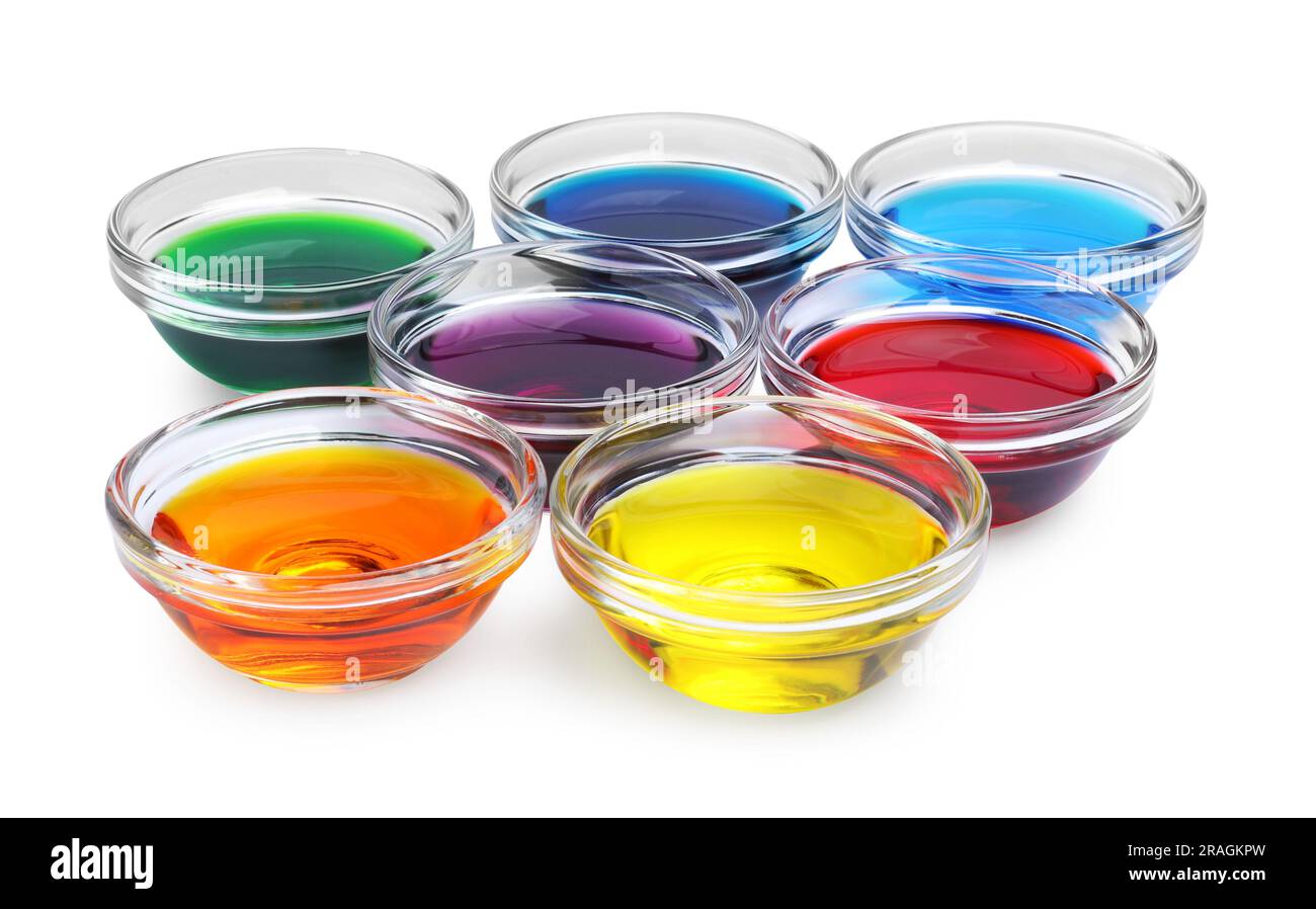 Glass bowls with different food coloring on white background Stock ...