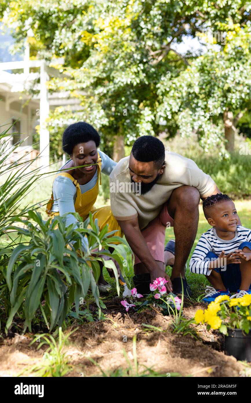 Kid garden parents planting hi-res stock photography and images - Alamy