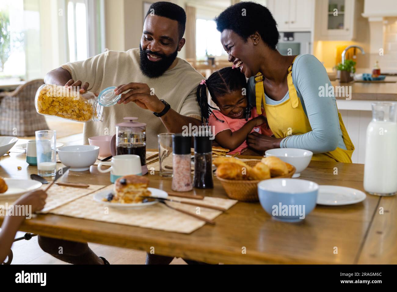 African american parents and daughter laughing cheerfully and having ...