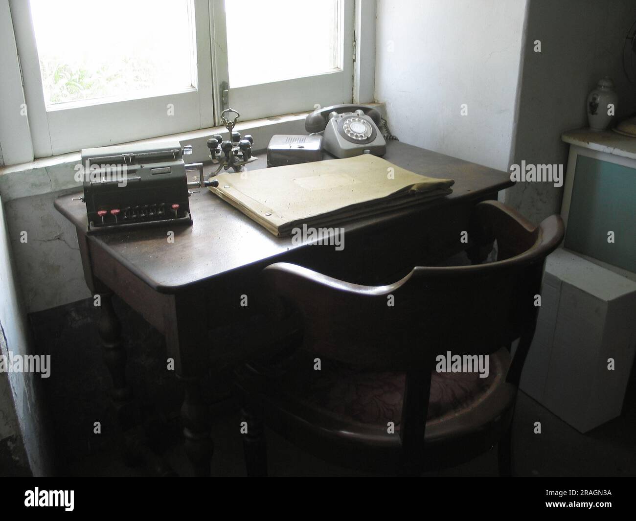 Dark depressive office with a desk, a phone and a closed diary Stock ...