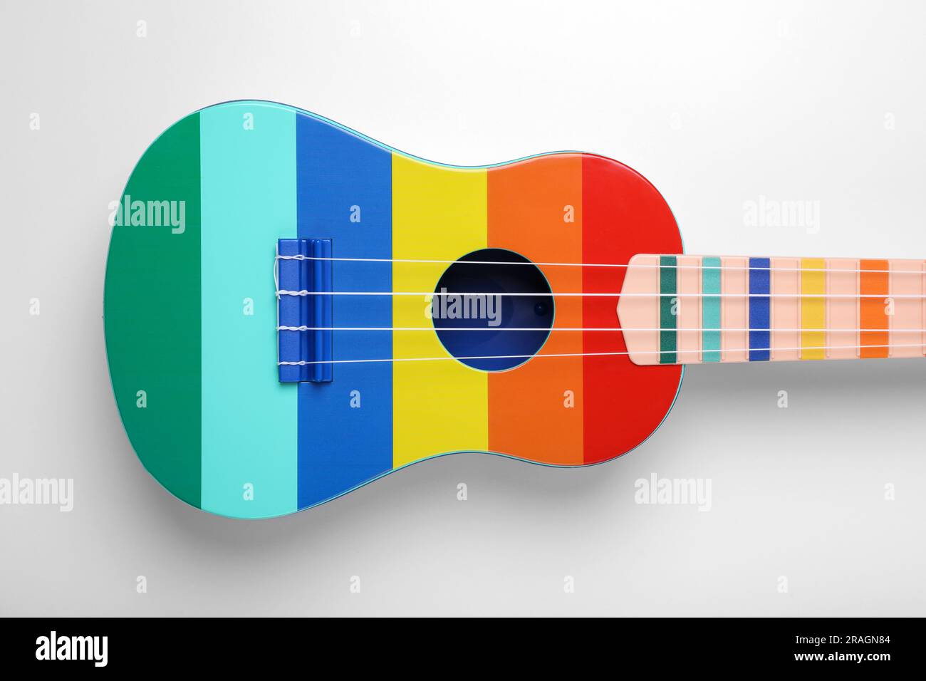 Colorful ukulele on white background, top view. String musical ...