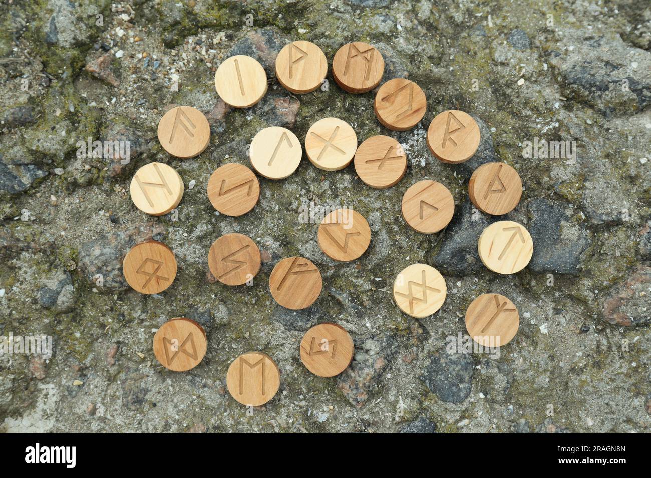 Many wooden runes on stone outdoors, flat lay Stock Photo - Alamy