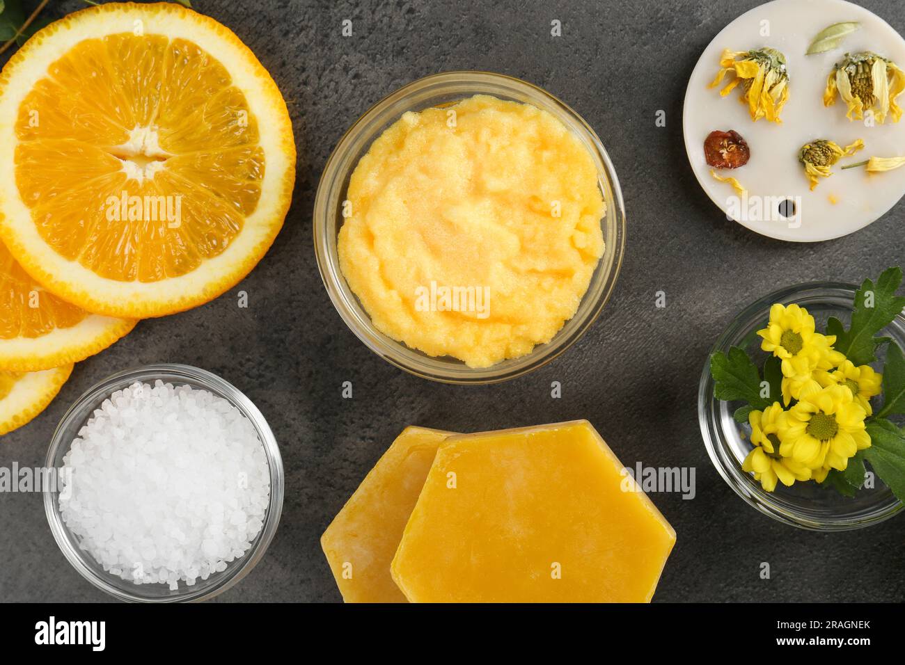 Homemade cosmetic products and fresh ingredients on black table, flat ...