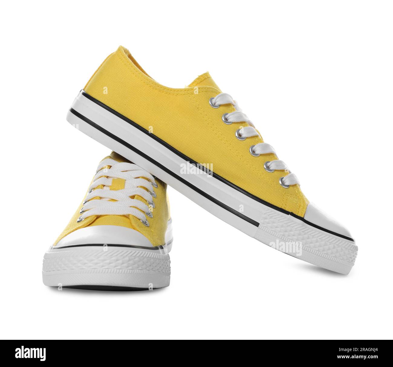 Pair of yellow classic old school sneakers on white background Stock ...