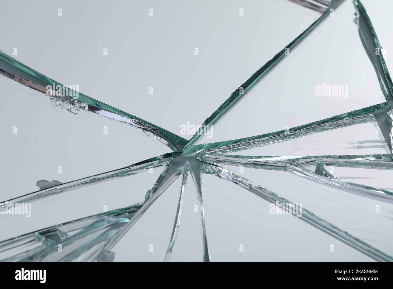 Broken mirror with many cracks as background, closeup view Stock Photo ...