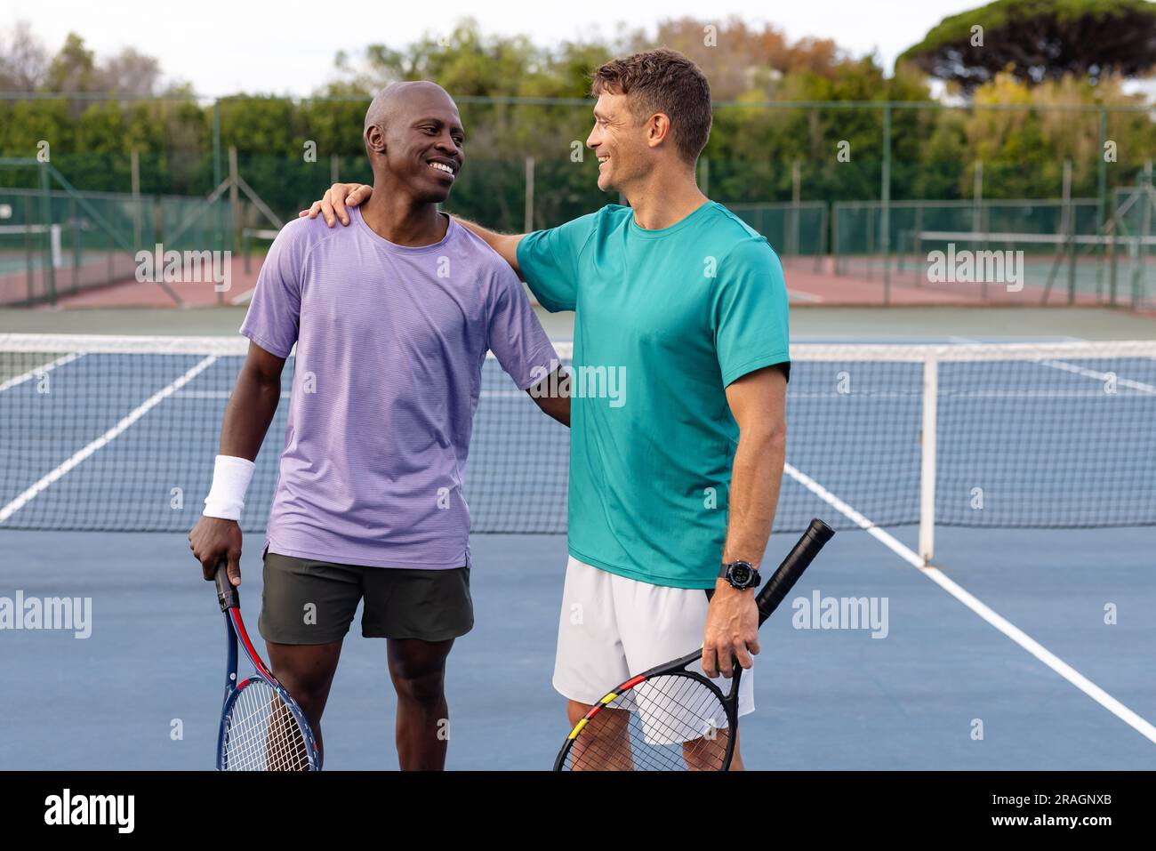 Happy diverse male tennis players hi-res stock photography and images ...