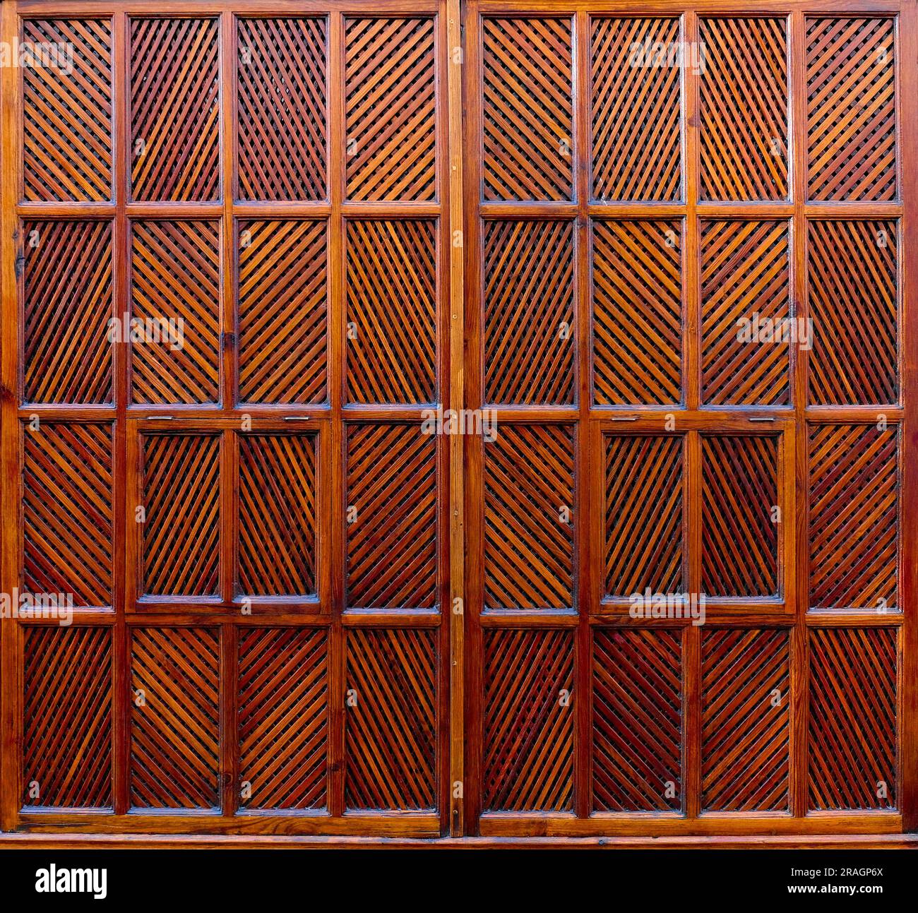 Decorative wooden shutters, wooden window covers in beautiful warm ...