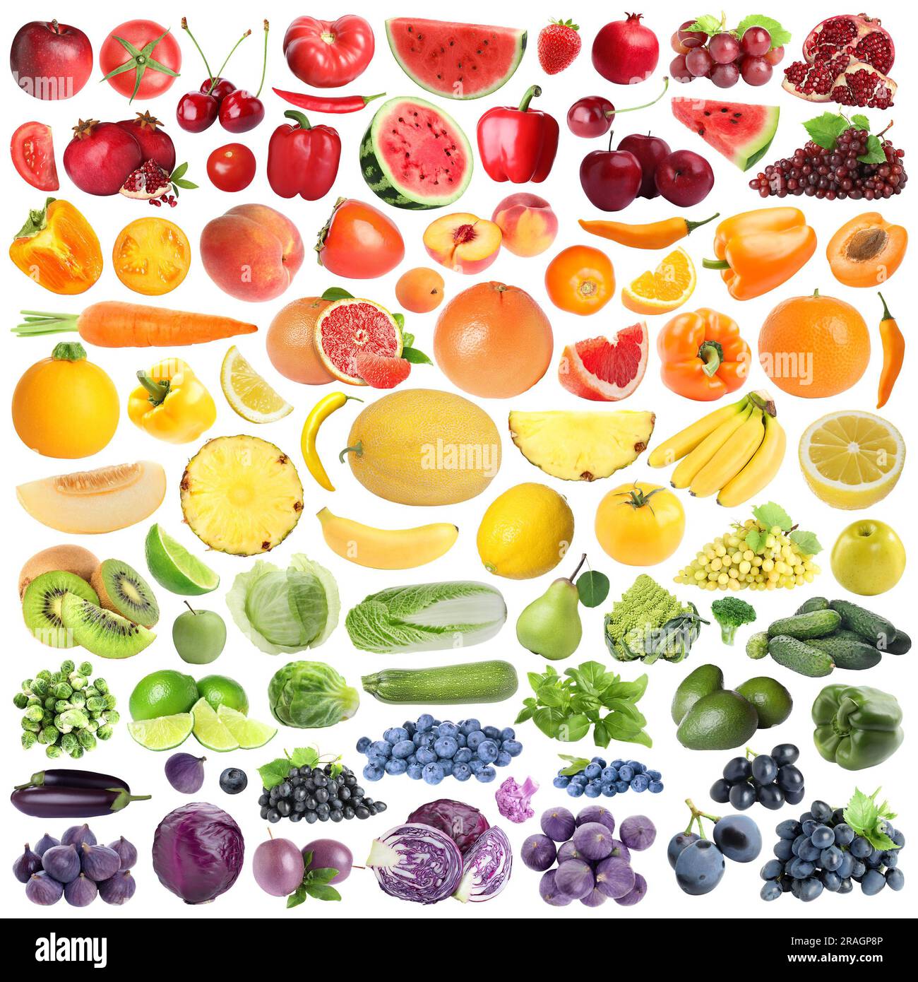 Many fresh fruits and vegetables arranged in rainbow colors on white ...