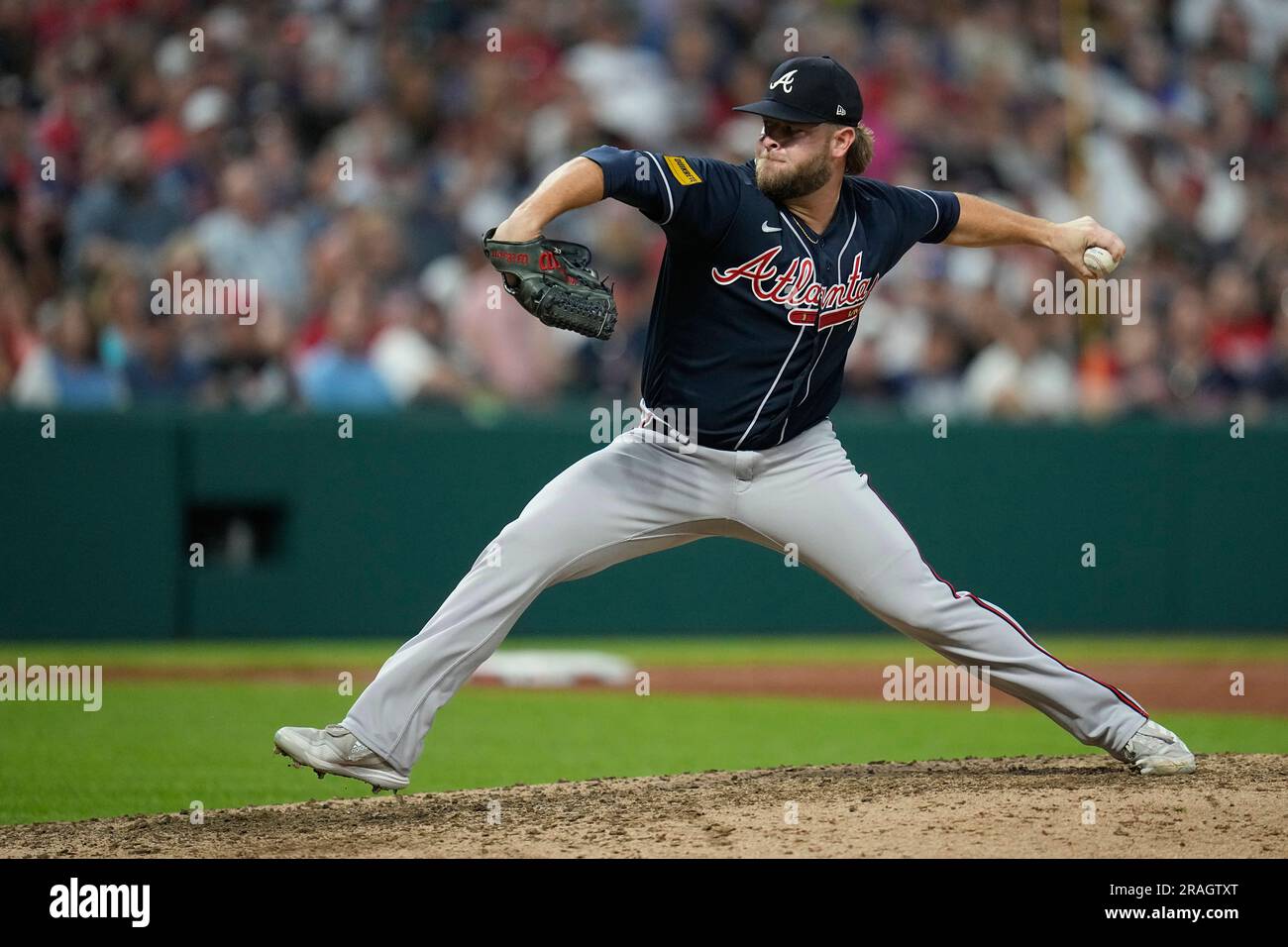 Atlanta Braves' A.J. Minter pitches in the eighth inning of a baseball ...