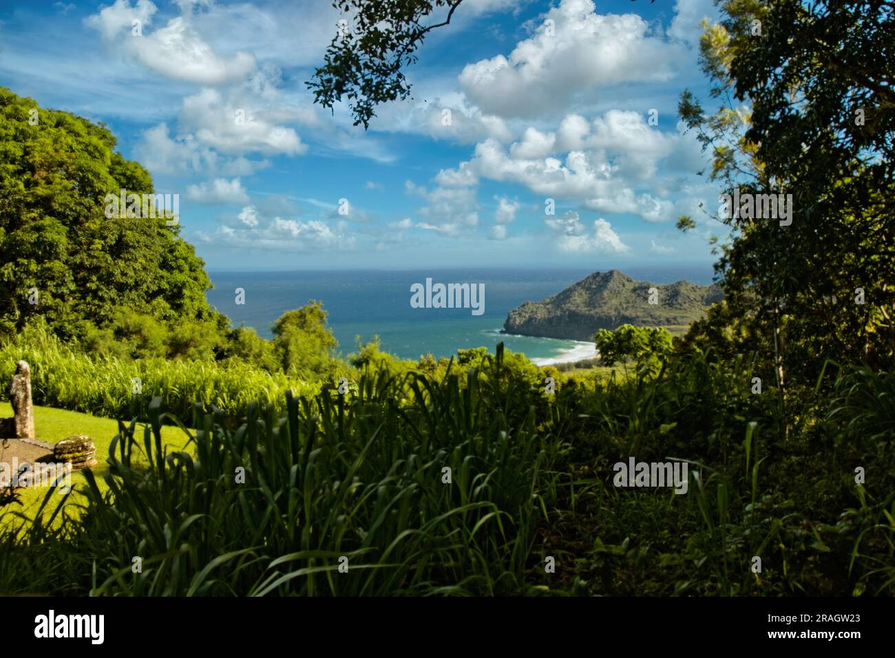 Overlook over the coastline of Kipu Kai Beach with majestic clouds ...
