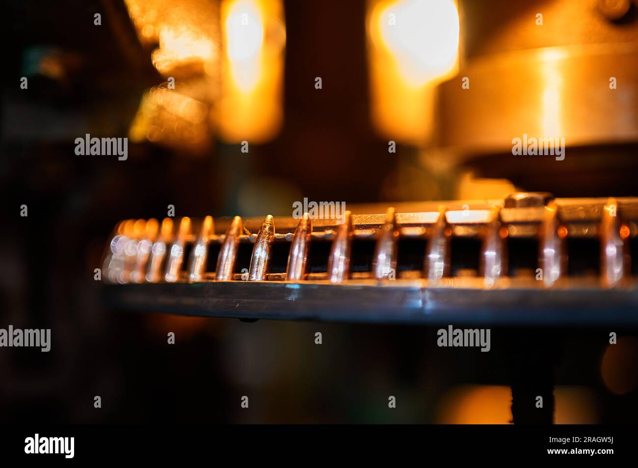 Copper bullets on production line part at weapon factory Stock Photo ...