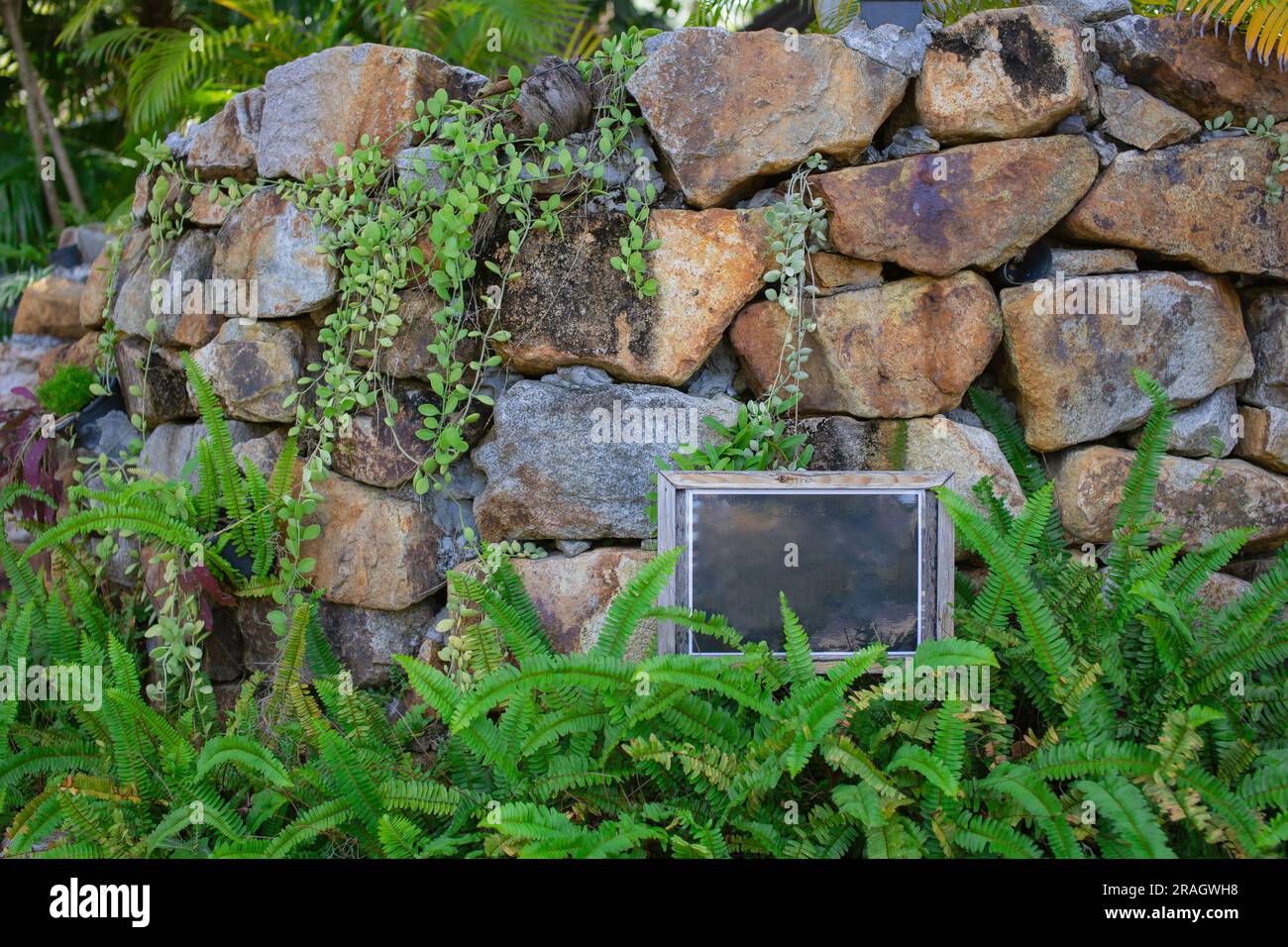 The garden is beautifully decorated with a layered stone decoration ...