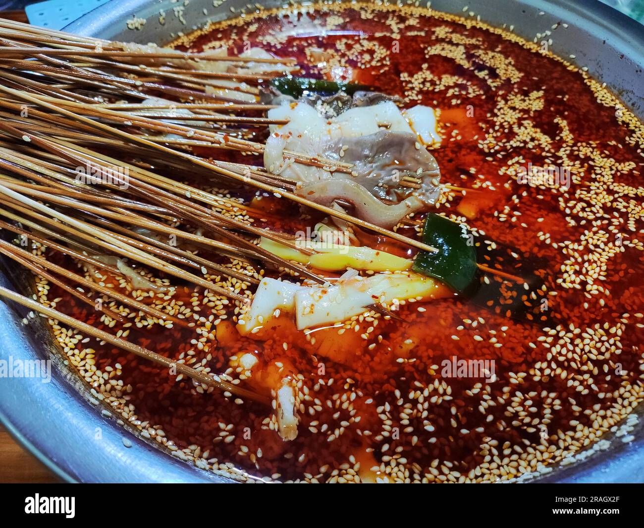 Fresh Sichuan bobo chicken in red spicy oil soup Stock Photo - Alamy