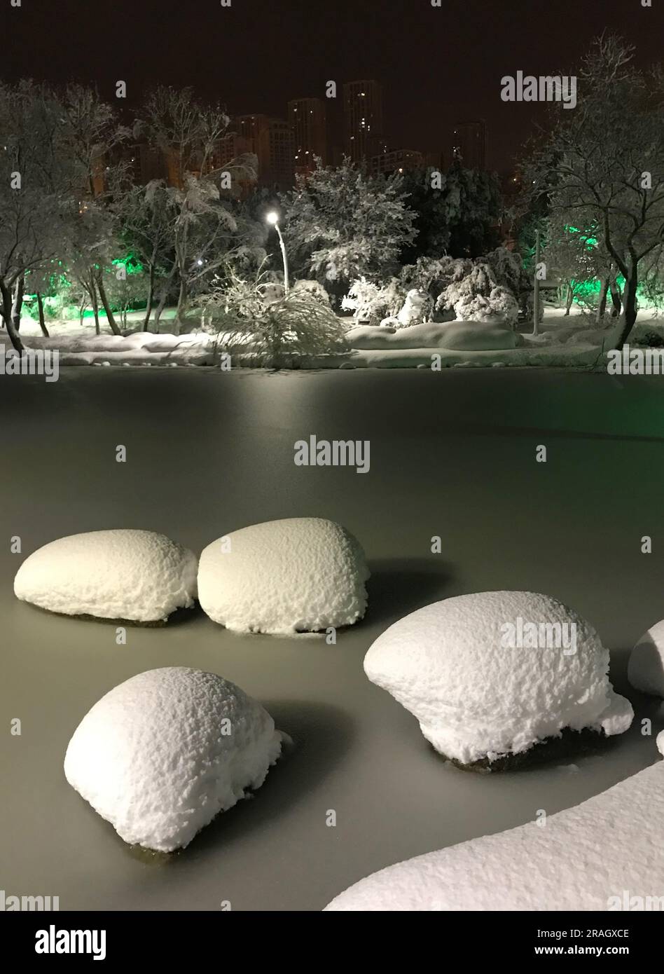 Frozen stones on frozen lake at snowy night in Istanbul, Turkey Stock ...