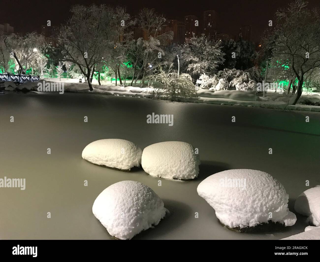 Frozen stones on frozen lake at snowy night in Istanbul, Turkey Stock ...