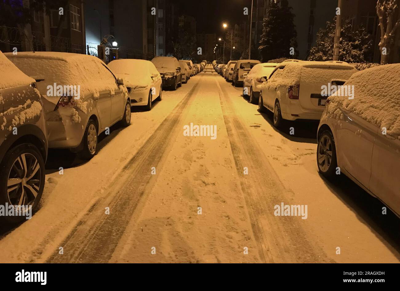 Snowy road and cars at a snowy night in Istanbul, Turkey Stock Photo ...