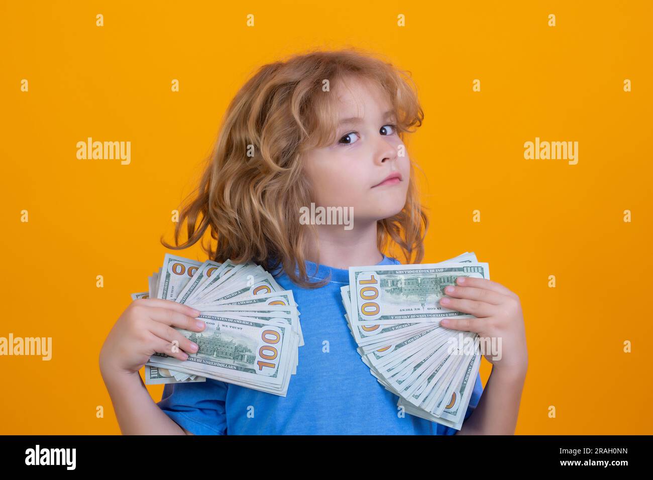 Happy rich kid boy with money dollars cash Stock Photo - Alamy