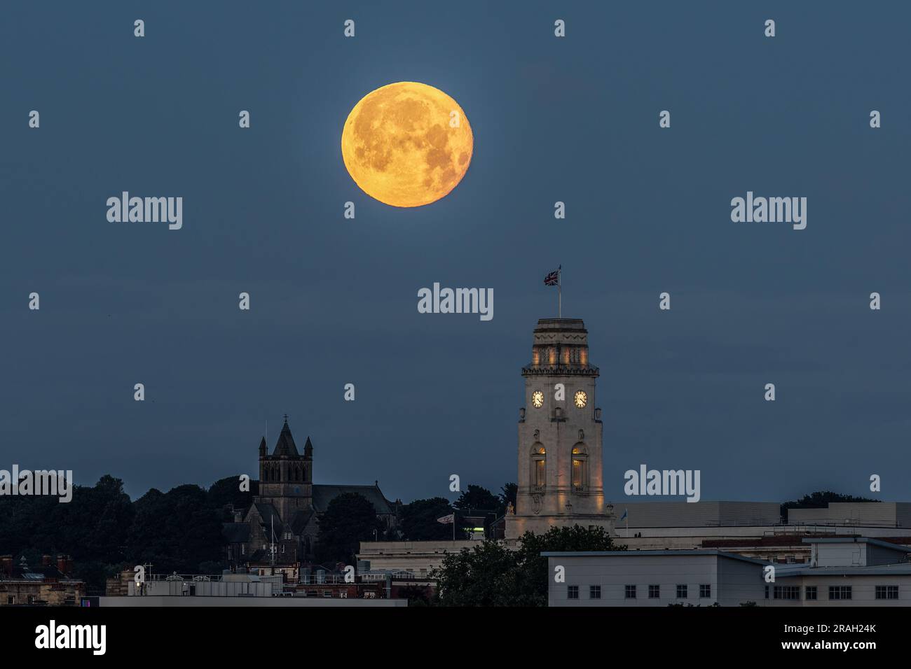 July’s supermoon, the Buck Moon sets over Barnsley Town Hall. Julys ...