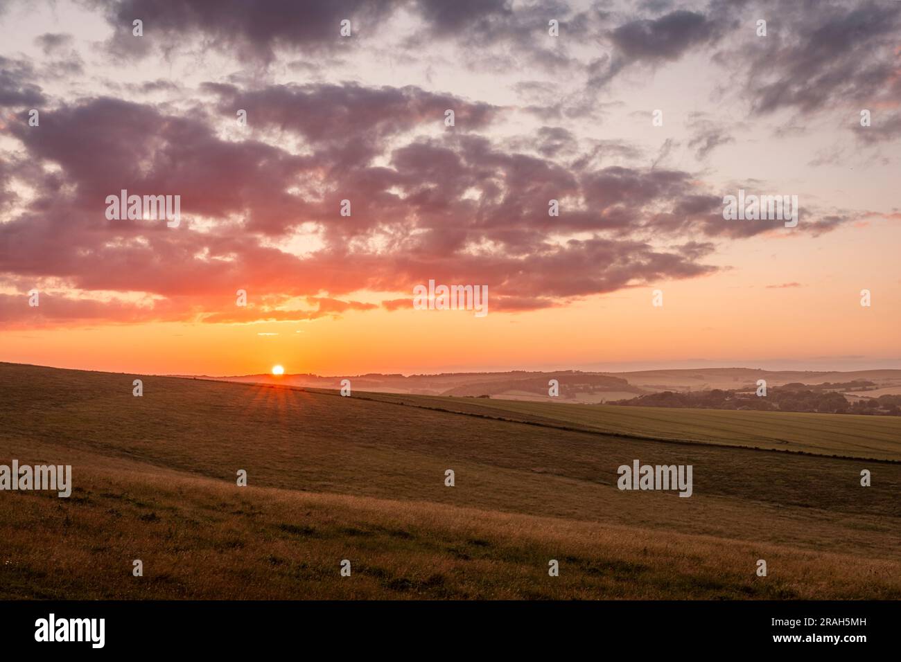 July sunset over the south downs from Falmer Road Brighton East Sussex ...