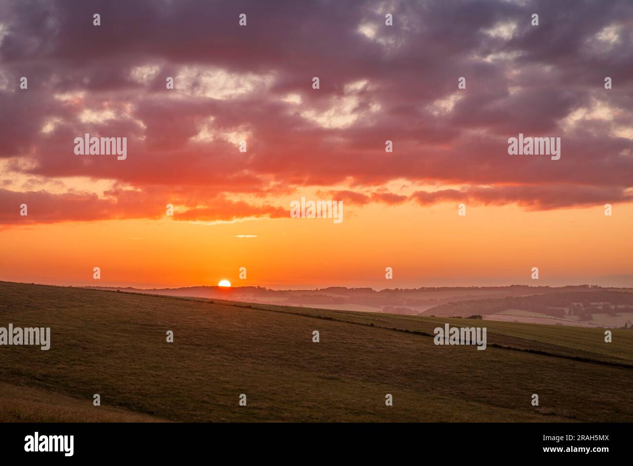 July sunset over the south downs from Falmer Road Brighton East Sussex ...