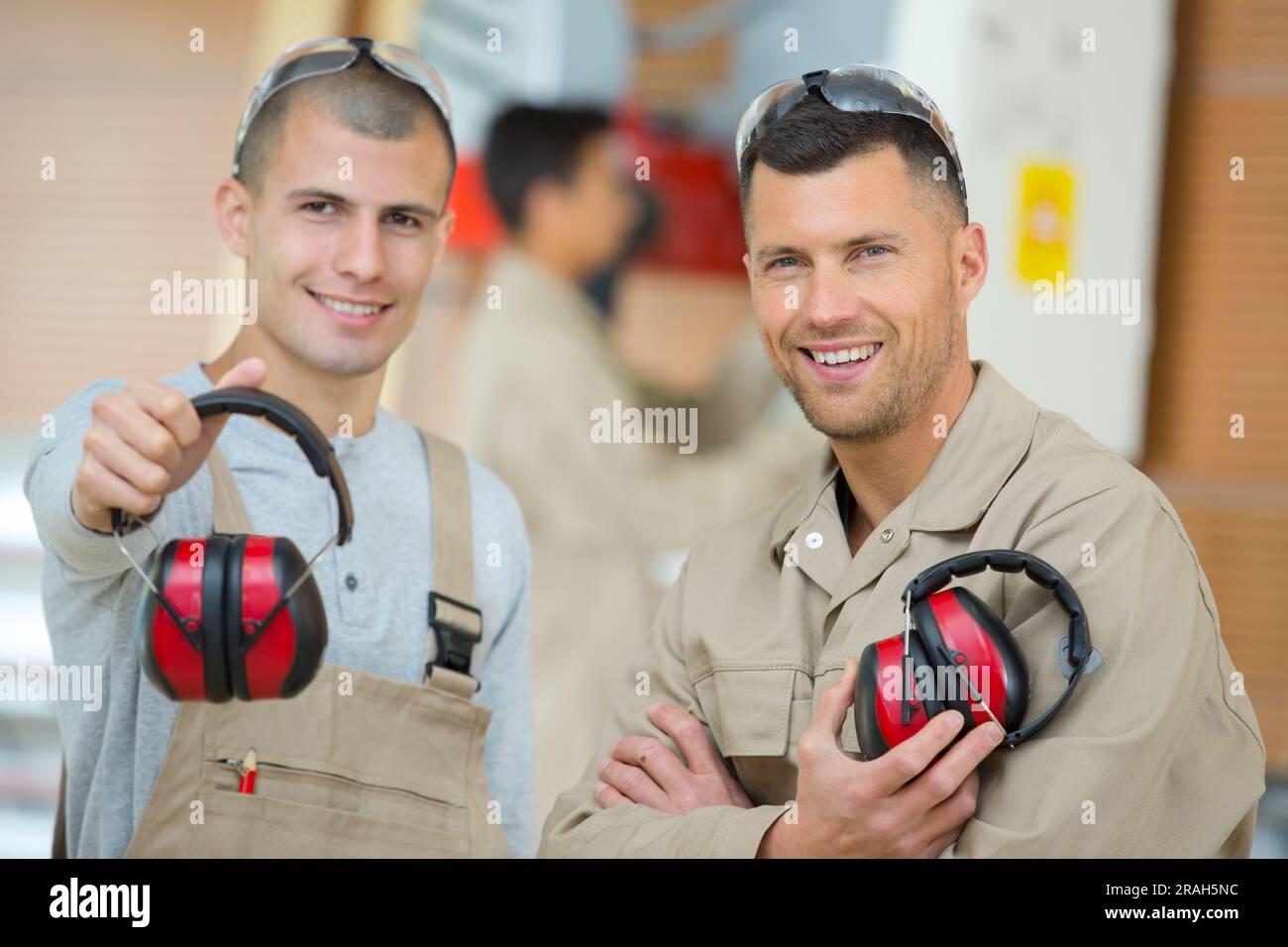 two men in workwear in a carpenters workshop Stock Photo - Alamy