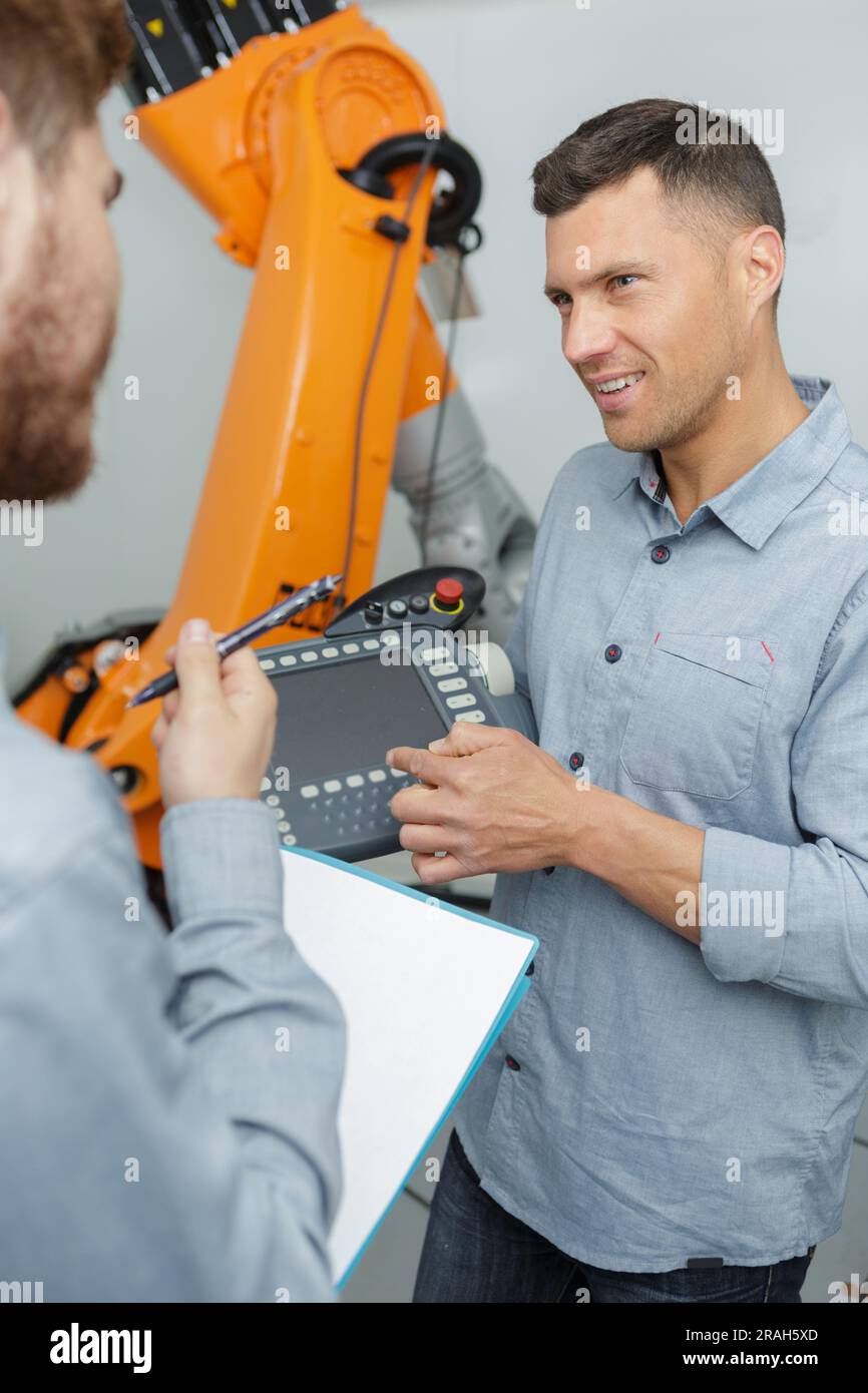 men and robotic arm concept Stock Photo - Alamy