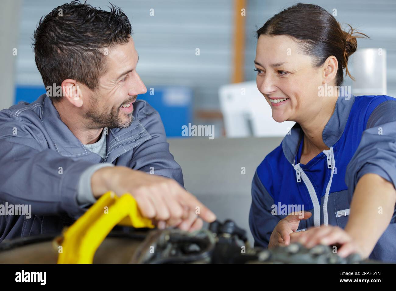 airplane service crew repairing plane in hangar Stock Photo - Alamy