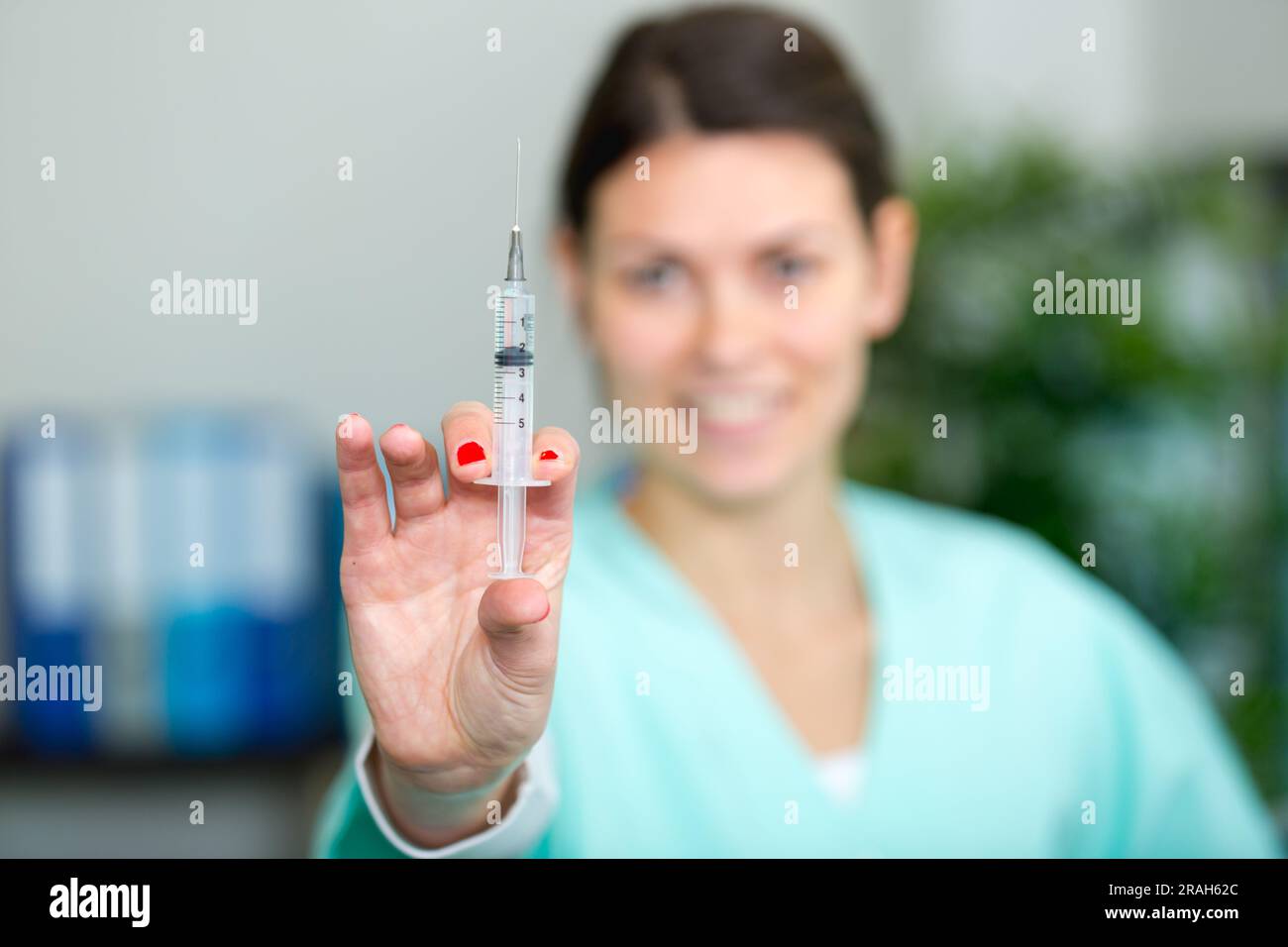 portrait of nurse showing a injection Stock Photo - Alamy