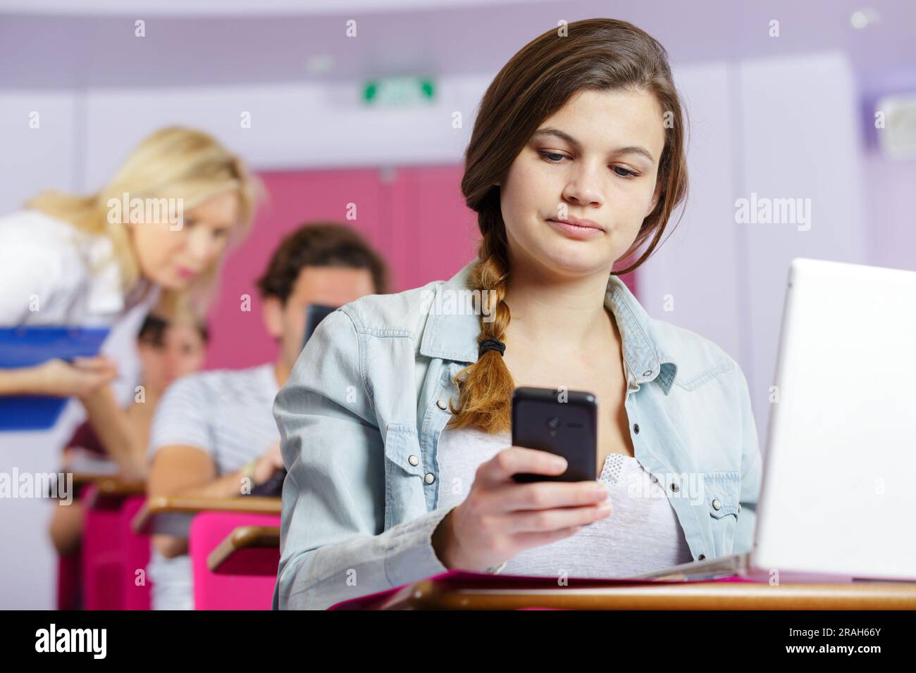 medical students with phone and laptops in auditorium Stock Photo - Alamy