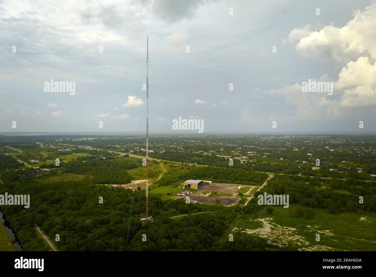 Aerial view of telecommunications cell phone tower with wireless communication 5g antennas for ...