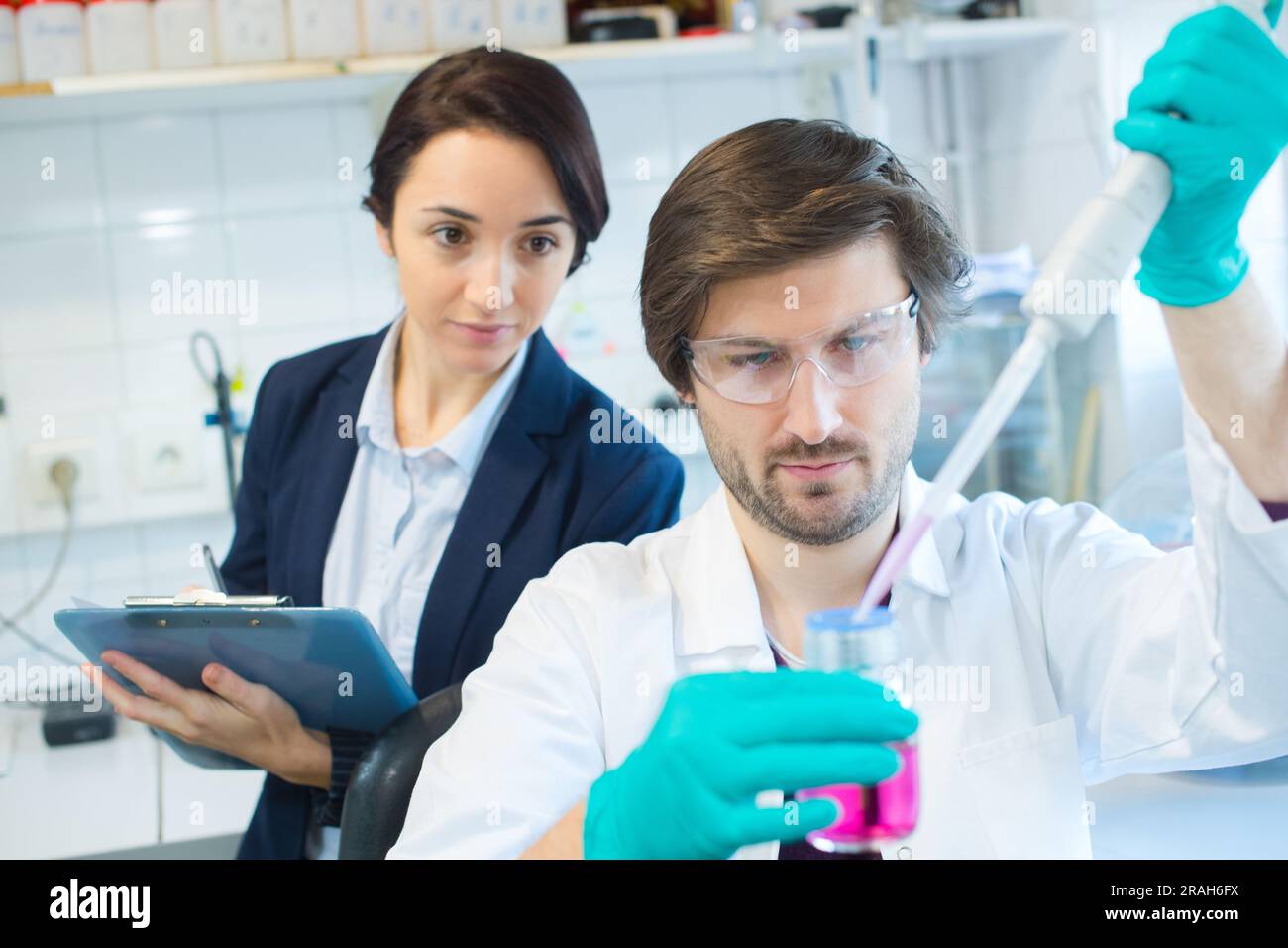 Group laboratory scientists examining hi-res stock photography and ...
